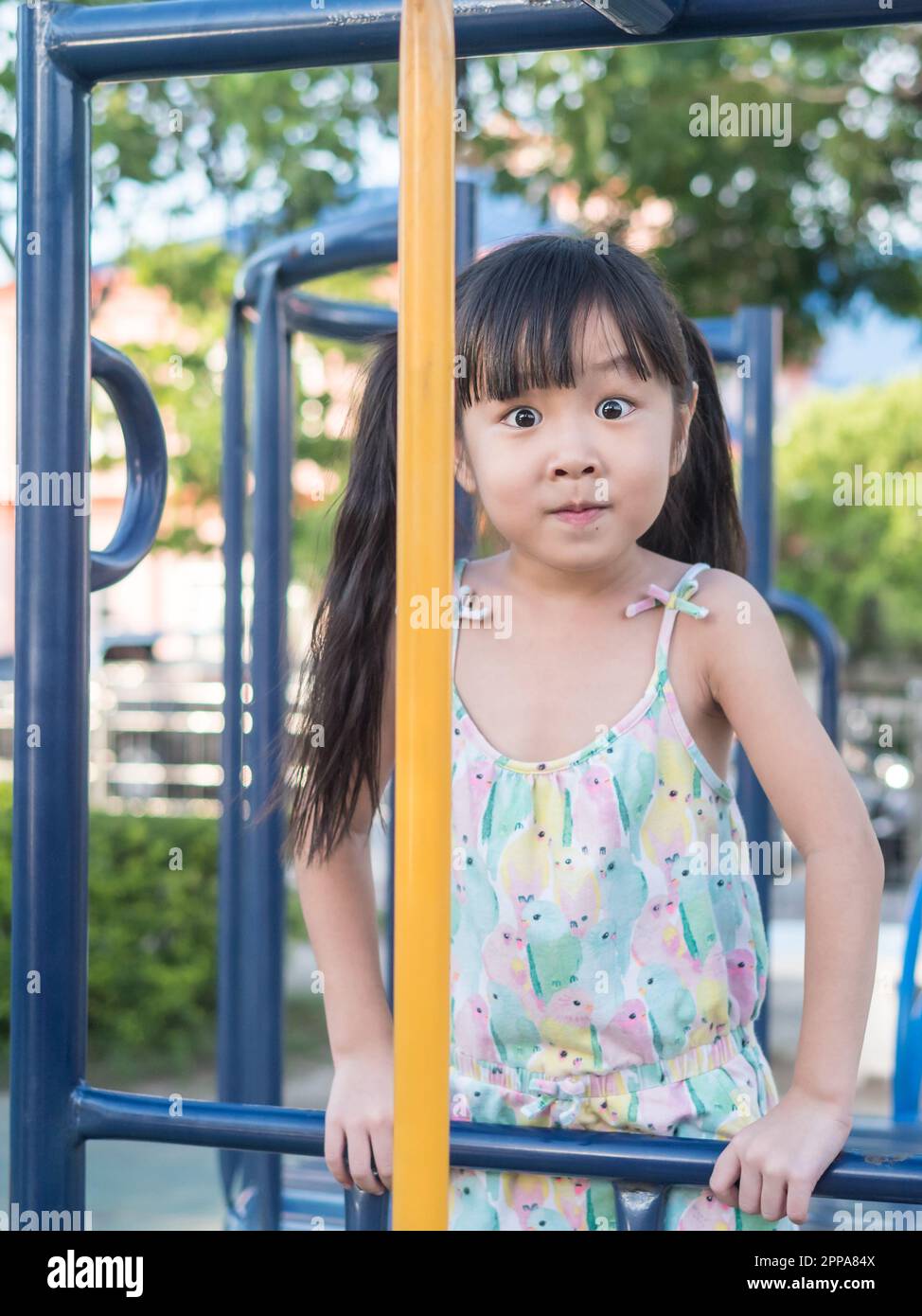 asian baby child playing on playground, surprise action , big eyes ...