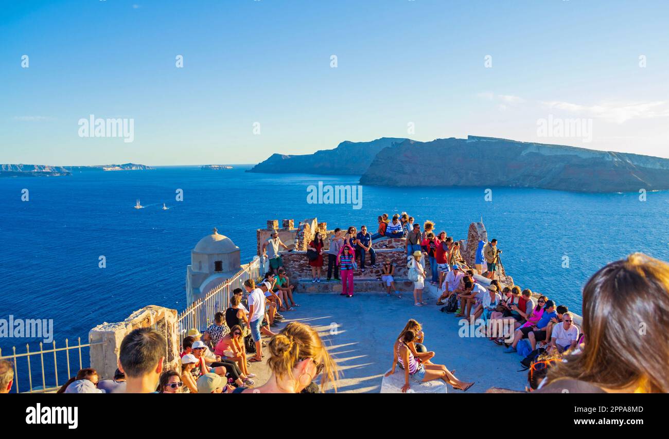 crowded Castle of Oia -the most photographed village in Greece .It is ...
