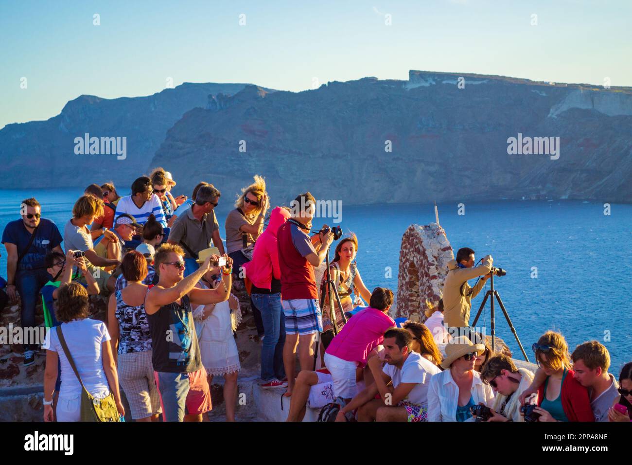 crowded Castle of Oia -the most photographed village in Greece .It is ...