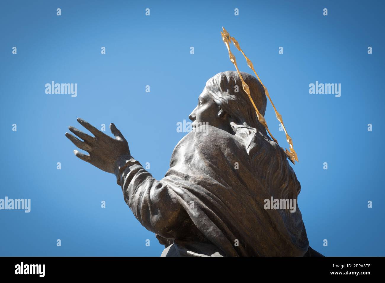 A statue of the Virgin Mary outside the Sanctuary Basilica of the ...