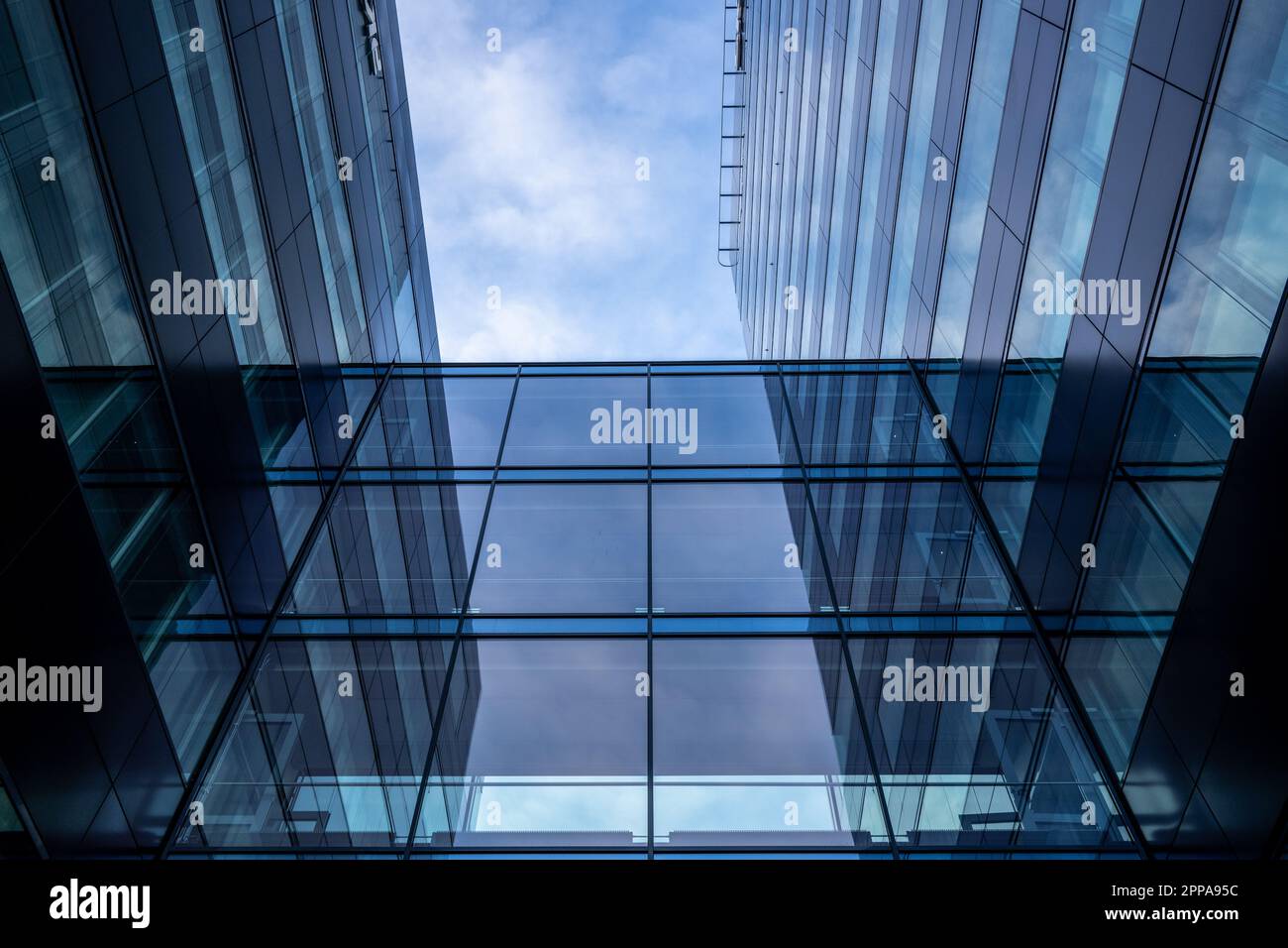 Reflections in glass facade of an office high rise Stock Photo - Alamy