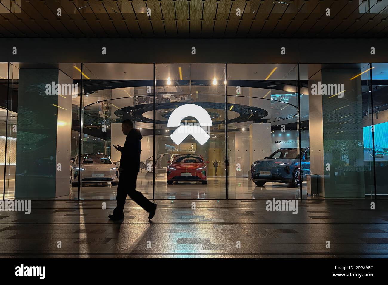 SHANGHAI, CHINA - APRIL 23, 2023 - Citizens walk past the NIO Auto ...