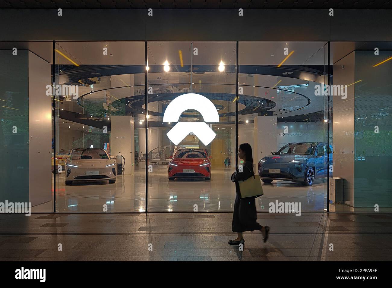 SHANGHAI, CHINA - APRIL 23, 2023 - Citizens walk past the NIO Auto ...