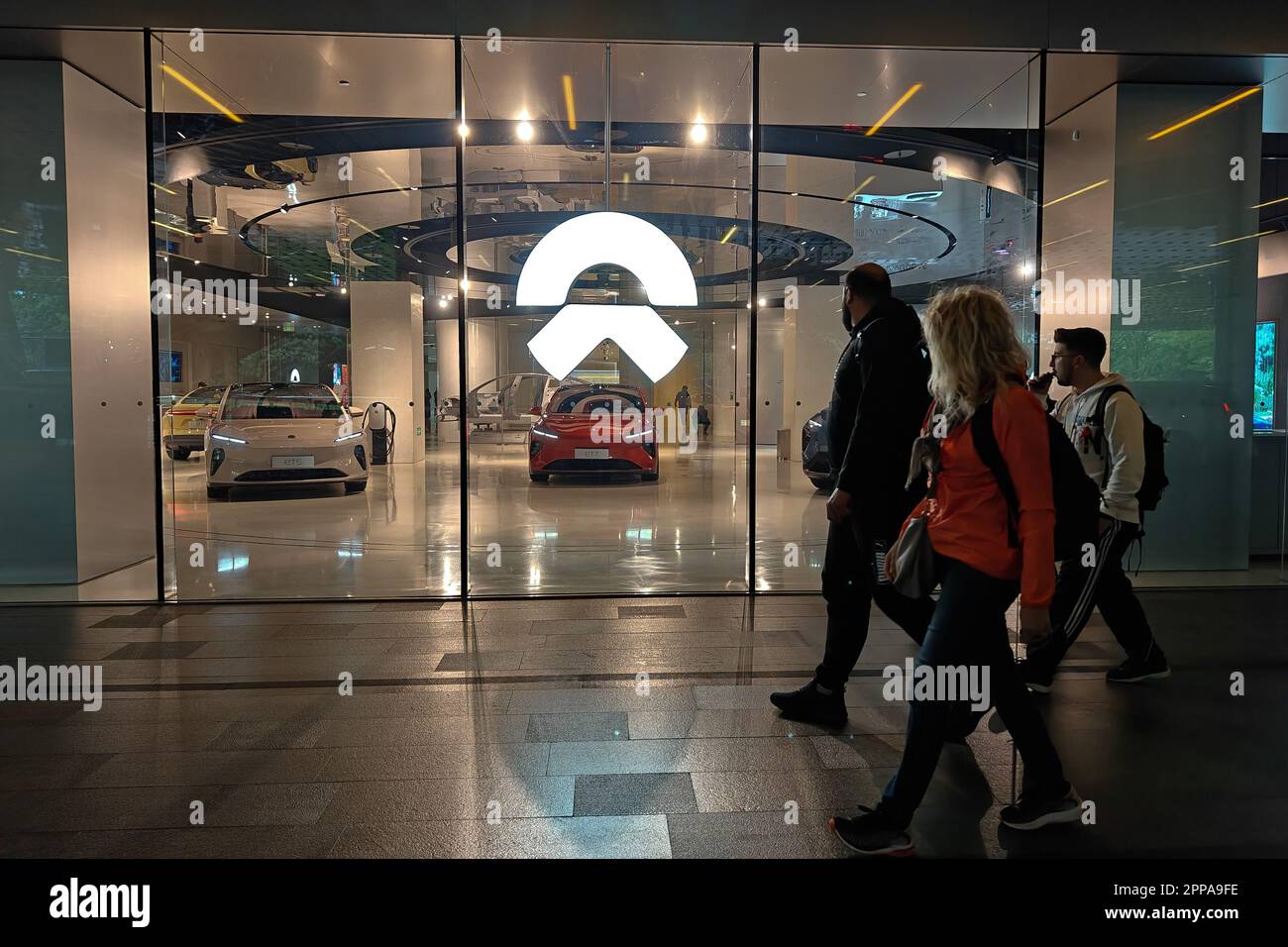 SHANGHAI, CHINA - APRIL 23, 2023 - Citizens walk past the NIO Auto ...