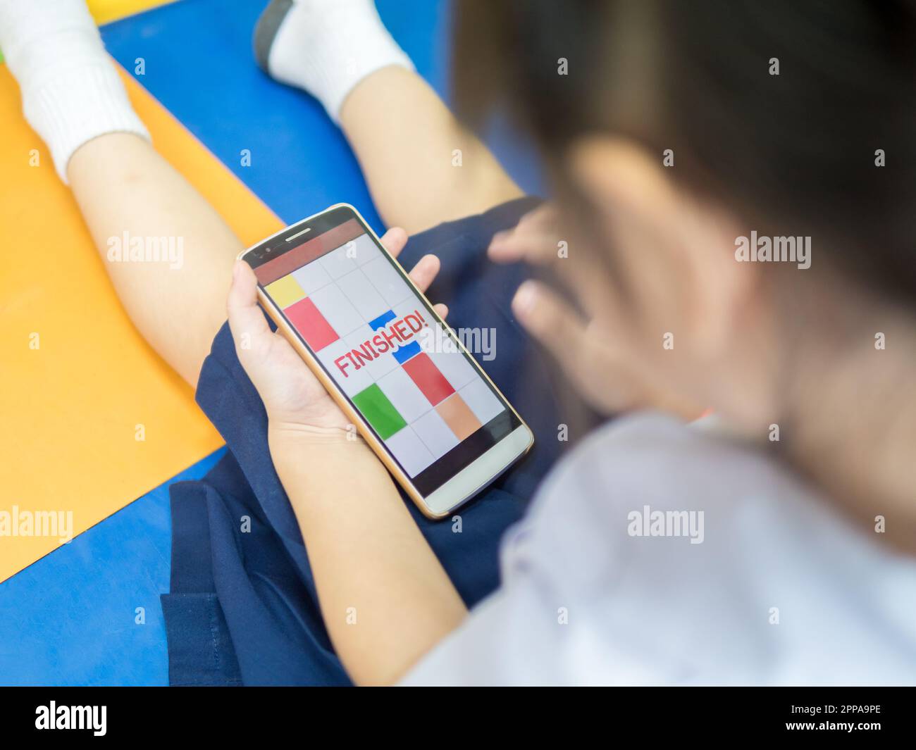 Asian child girl look smart phone Stock Photo - Alamy