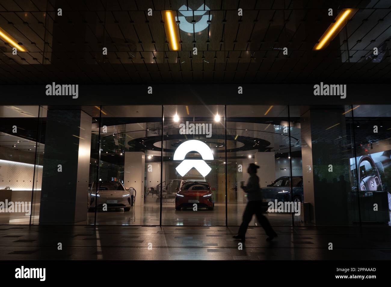 SHANGHAI, CHINA - APRIL 23, 2023 - Citizens walk past the NIO Auto ...