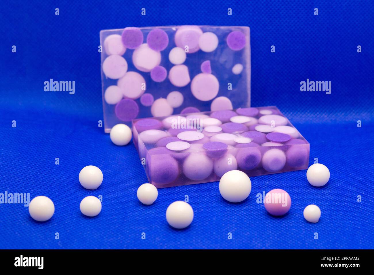 Unusual fragrant handmade soap with colored soap balls blue background ...