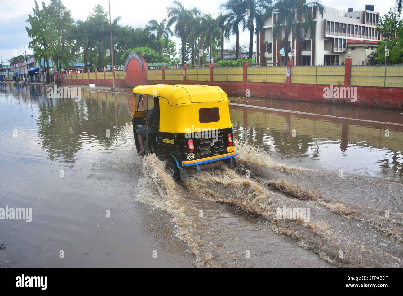 Dimapur, India. 23rd Apr, 2023. A Vehicle passes through a water logged ...