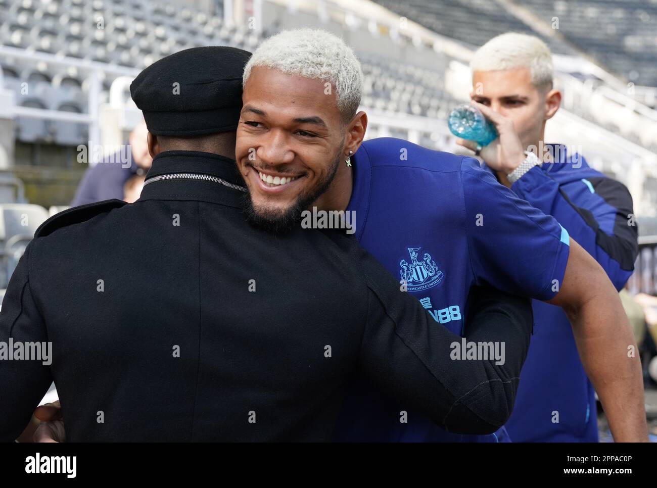 Newcastle United's Joelinton (centre) greets former team-mate Danny ...