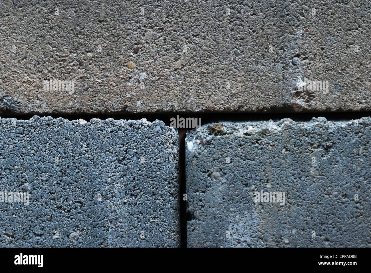 Gray building cinder blocks made of cement stacked close-up background ...