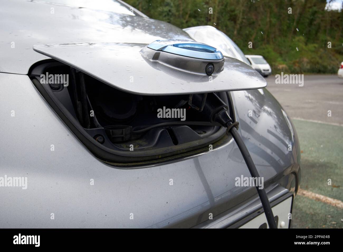 nissan leaf car front charging port with charging cable connected ...