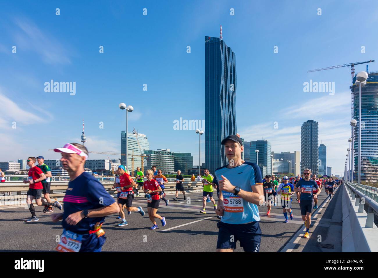 Vienna: start of 40. Vienna City Marathon, runner, skyline of Donaucity ...