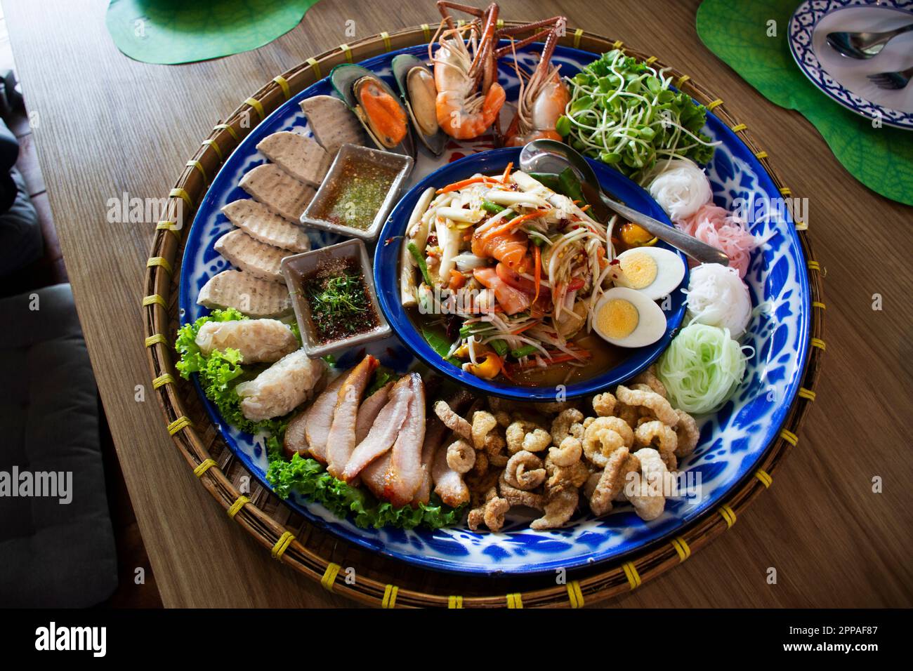 Traditional thai food local gourmet Som Tum or spicy green papaya salad ...