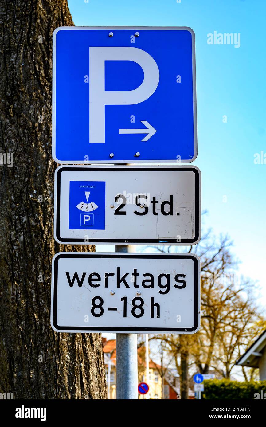 Parking lot sign with additional notes on a limited park duration of ...