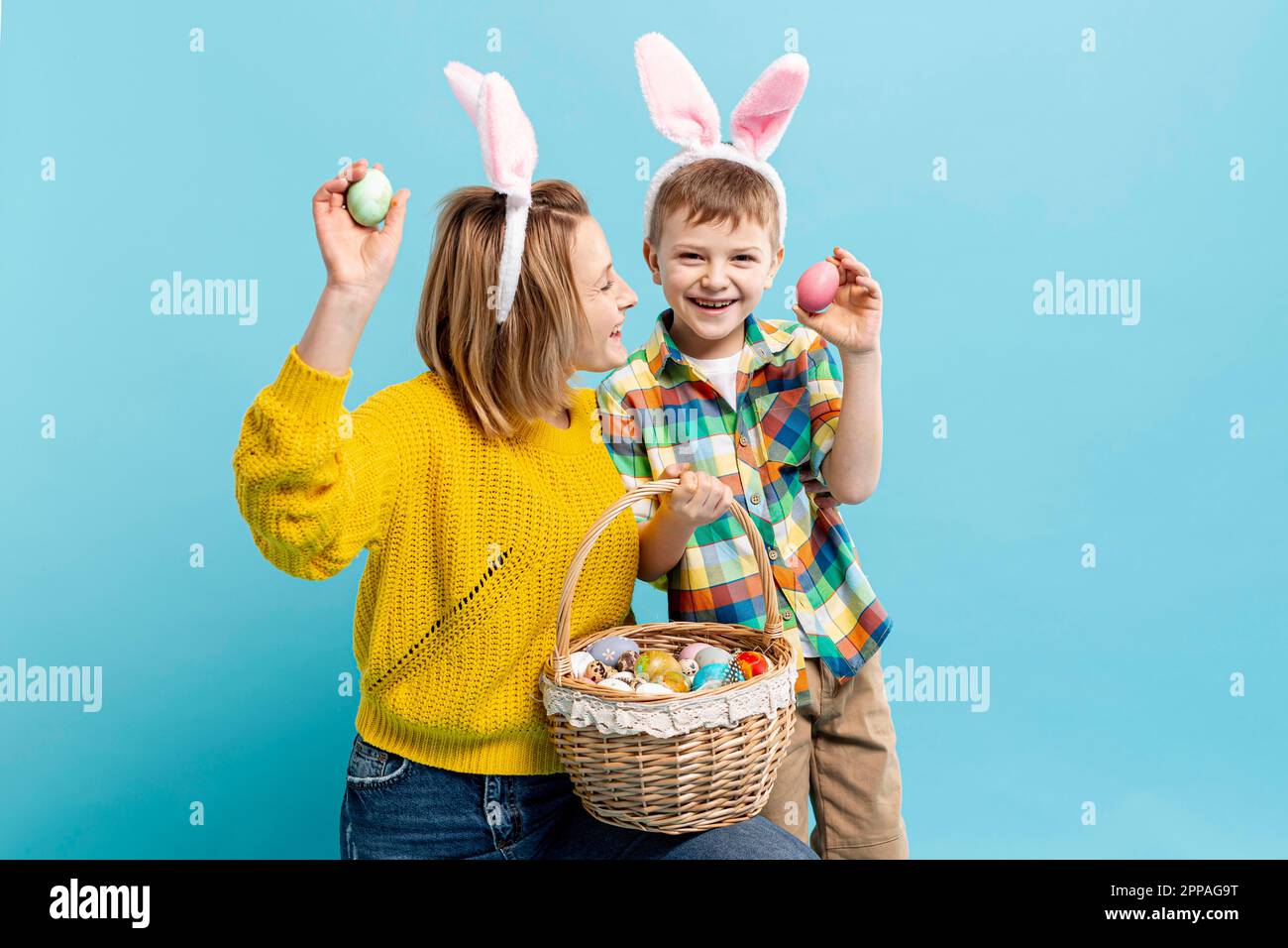 Mother son holding painted egg Stock Photo - Alamy