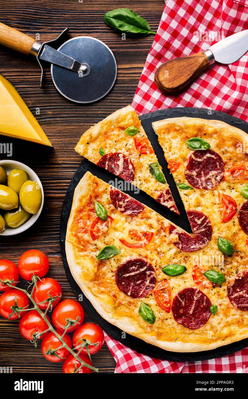 Flat lay tasty pizza composition Stock Photo - Alamy