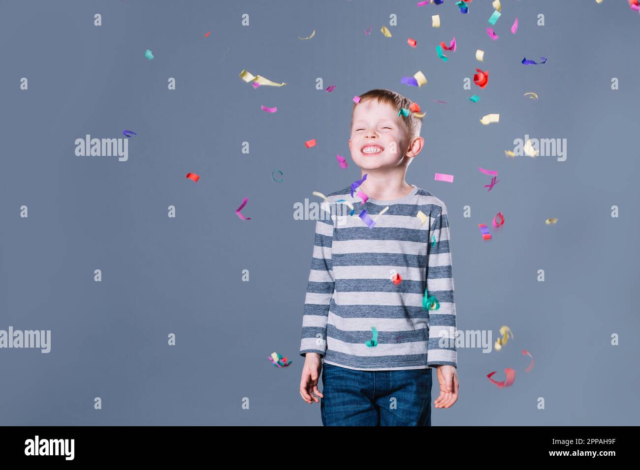 Cheerful boy confetti Stock Photo - Alamy Cheerful boy confetti Stock Photo - Alamy