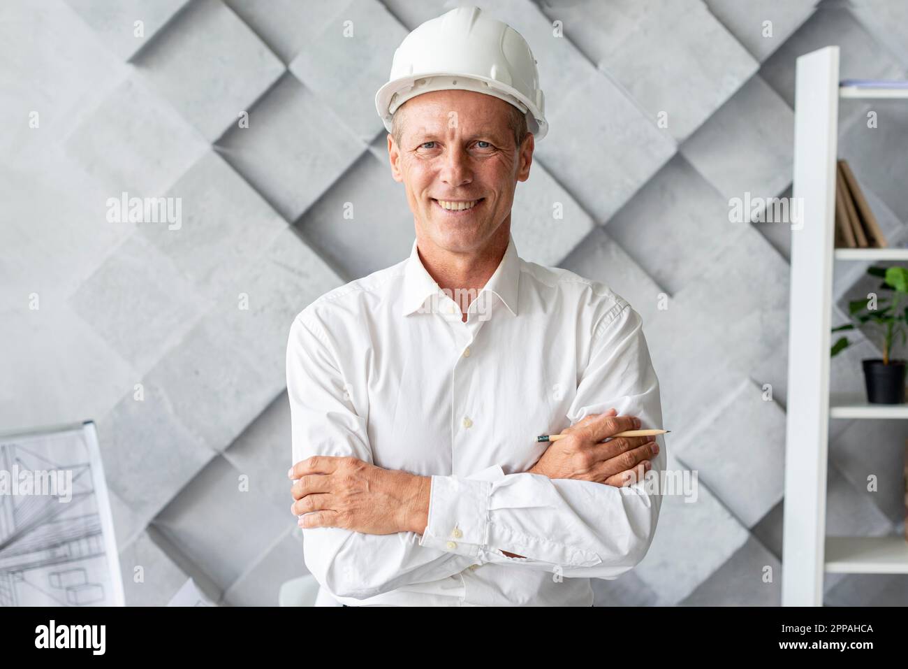 Architect with safety helmet posing Stock Photo - Alamy
