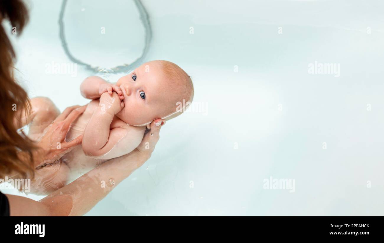 Close up woman washing baby Stock Photo - Alamy