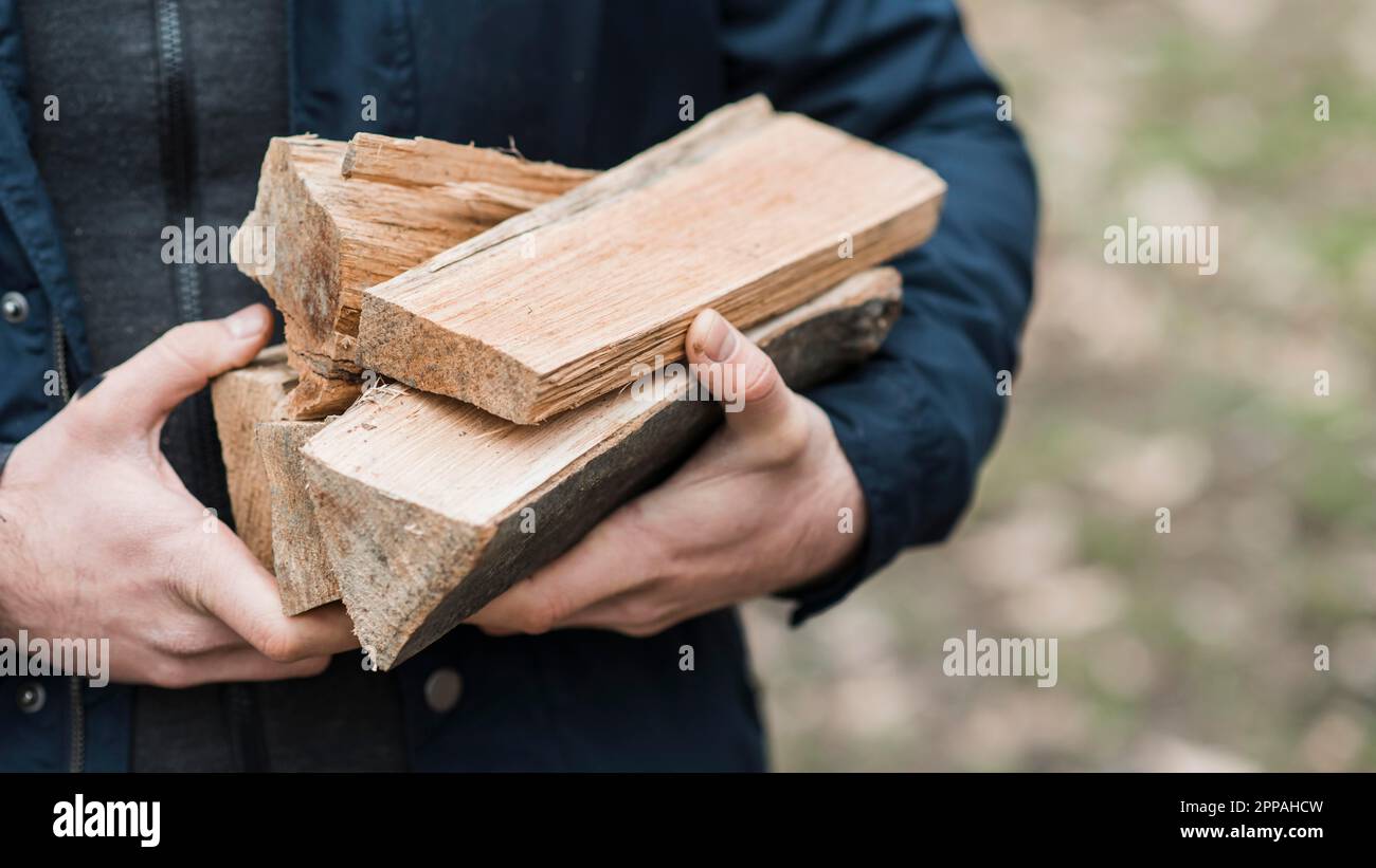 Man carrying plank of wood hi-res stock photography and images - Alamy