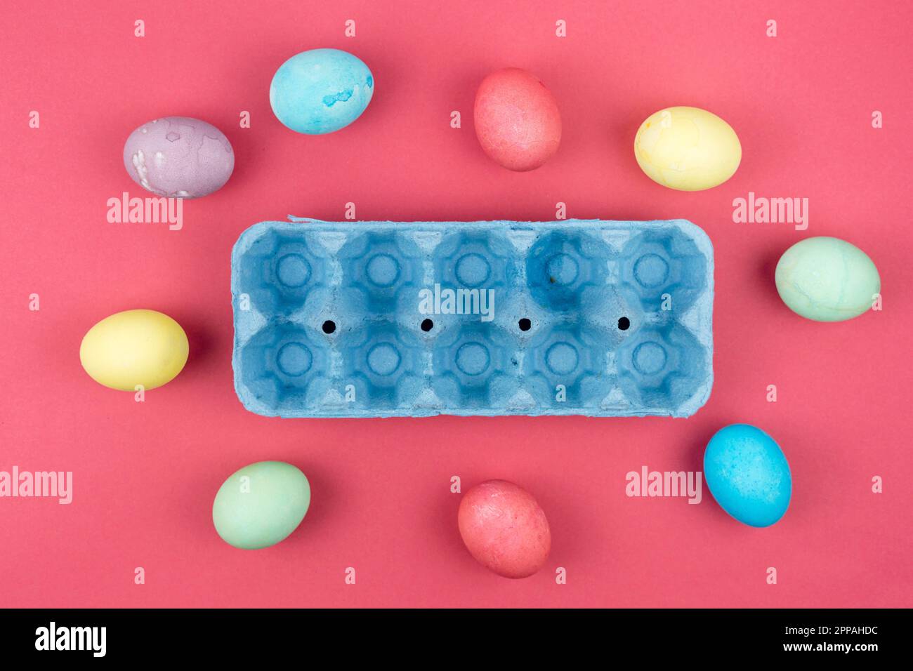 Colourful easter eggs with blue box table Stock Photo - Alamy