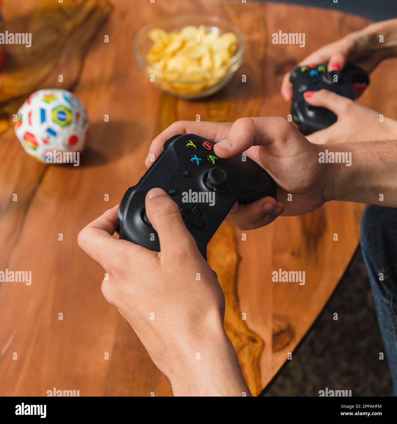Boys playing with console Stock Photo - Alamy