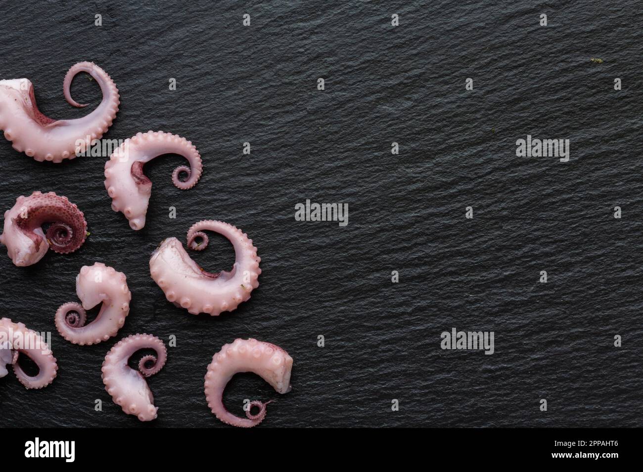 Top view small pieces octopus Stock Photo - Alamy