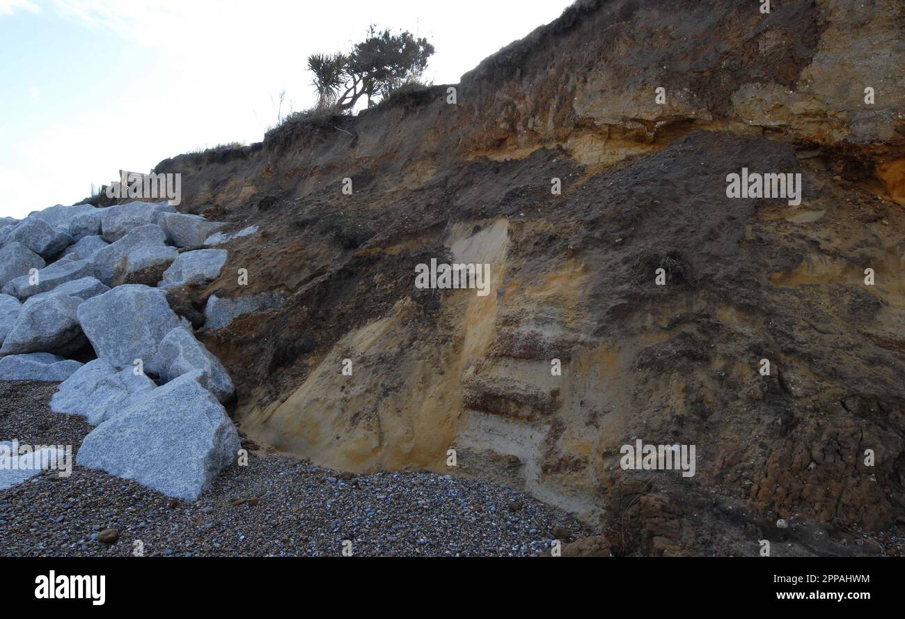 Damaged cliff surface next to rock flood defence installed to protect ...