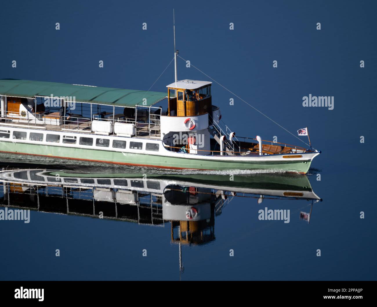 Ullswater Steamer "Raven" sailing across Ullswater on a crisp spring ...