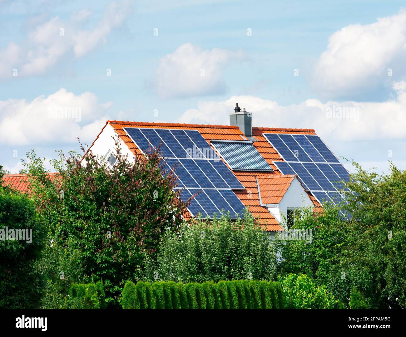 Modern house with photovoltaic solar cells on the roof and a thermal ...