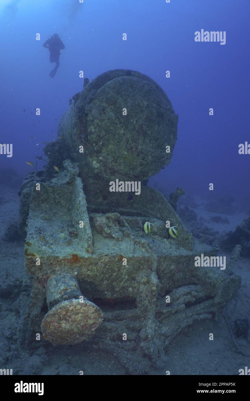 Remains of a World War II steam locomotive on the seabed, wreck. Divers ...