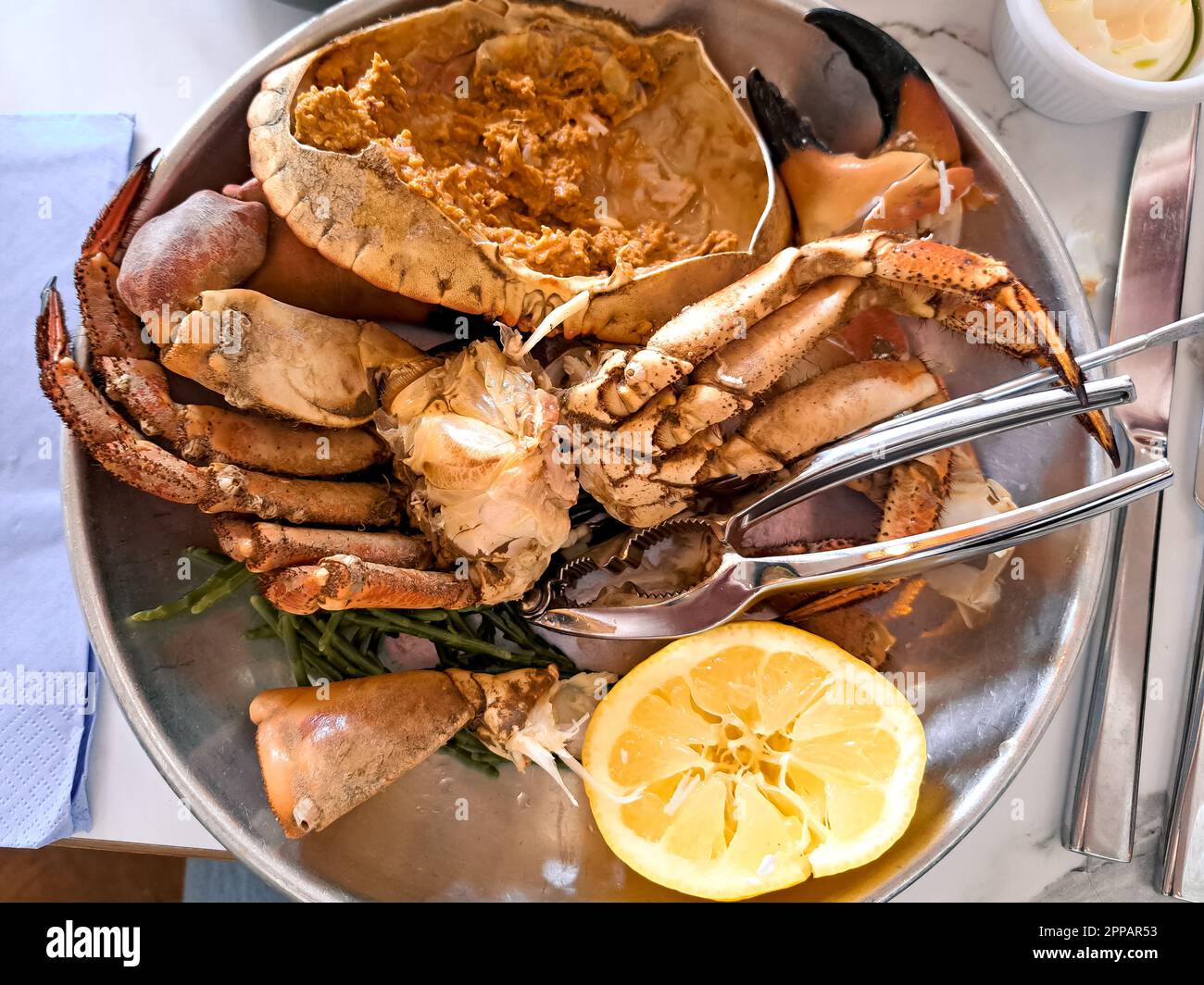 Boiled crab and seashells in plate,seafood on the table in restaurant ...
