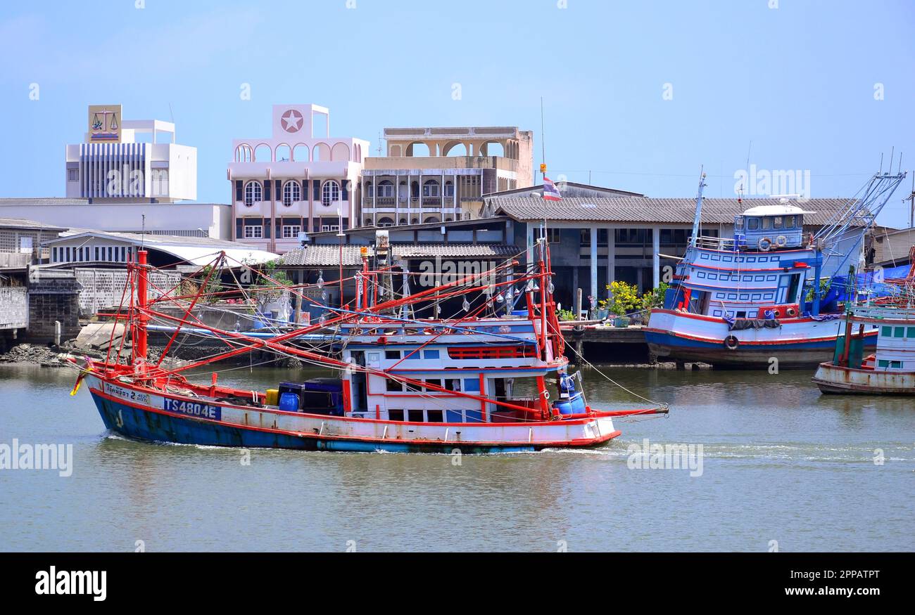 Colourful Thai fishing boats at the harbour on the Rayong River, Rayong Province, Thailand ...