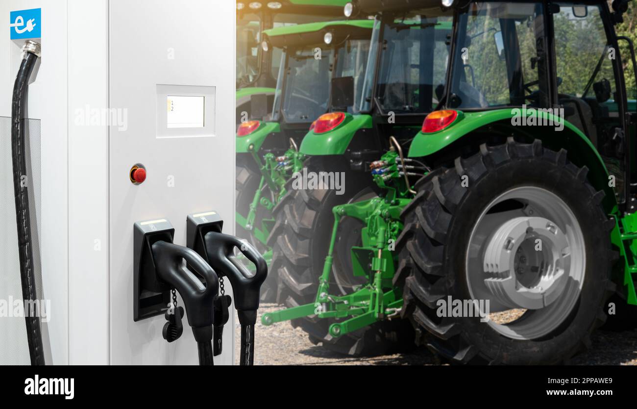 Electric vehicles charging station on a background of agricultural ...