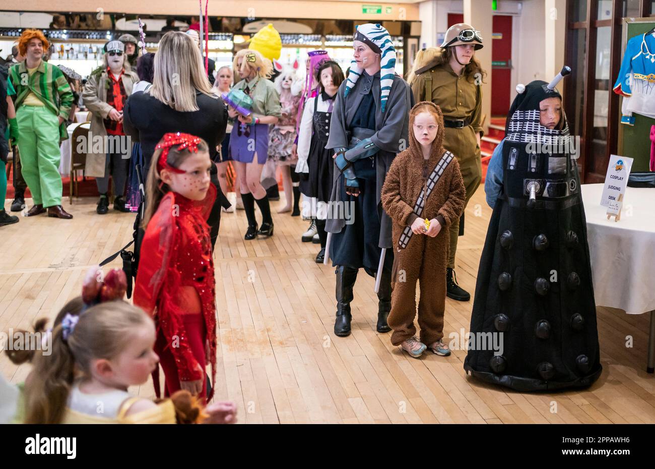 Attendees take part in a cosplay competition during the Sci Fi ...