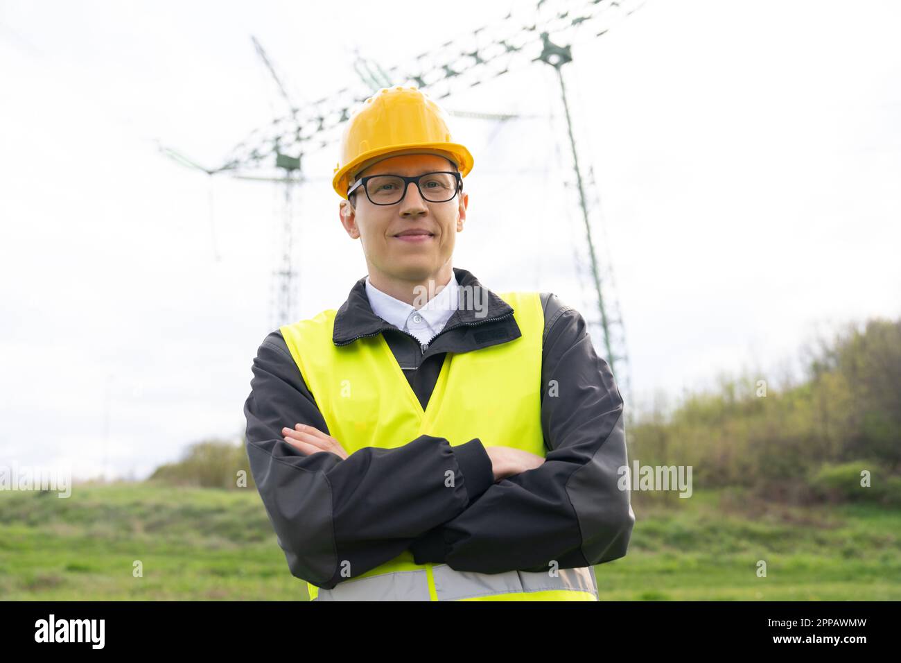 Engineer on a background of power line tower. High quality photo Stock ...