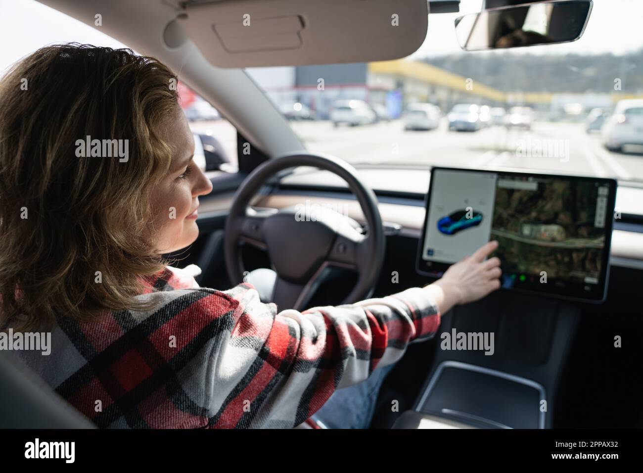 Woman driver touching dashboard hi-res stock photography and images - Alamy
