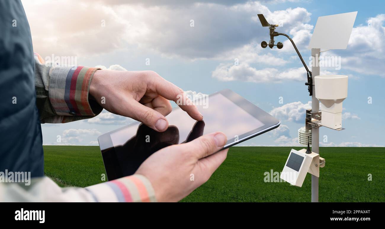 Farmer control weather station via digital tablet. Precision and smart ...