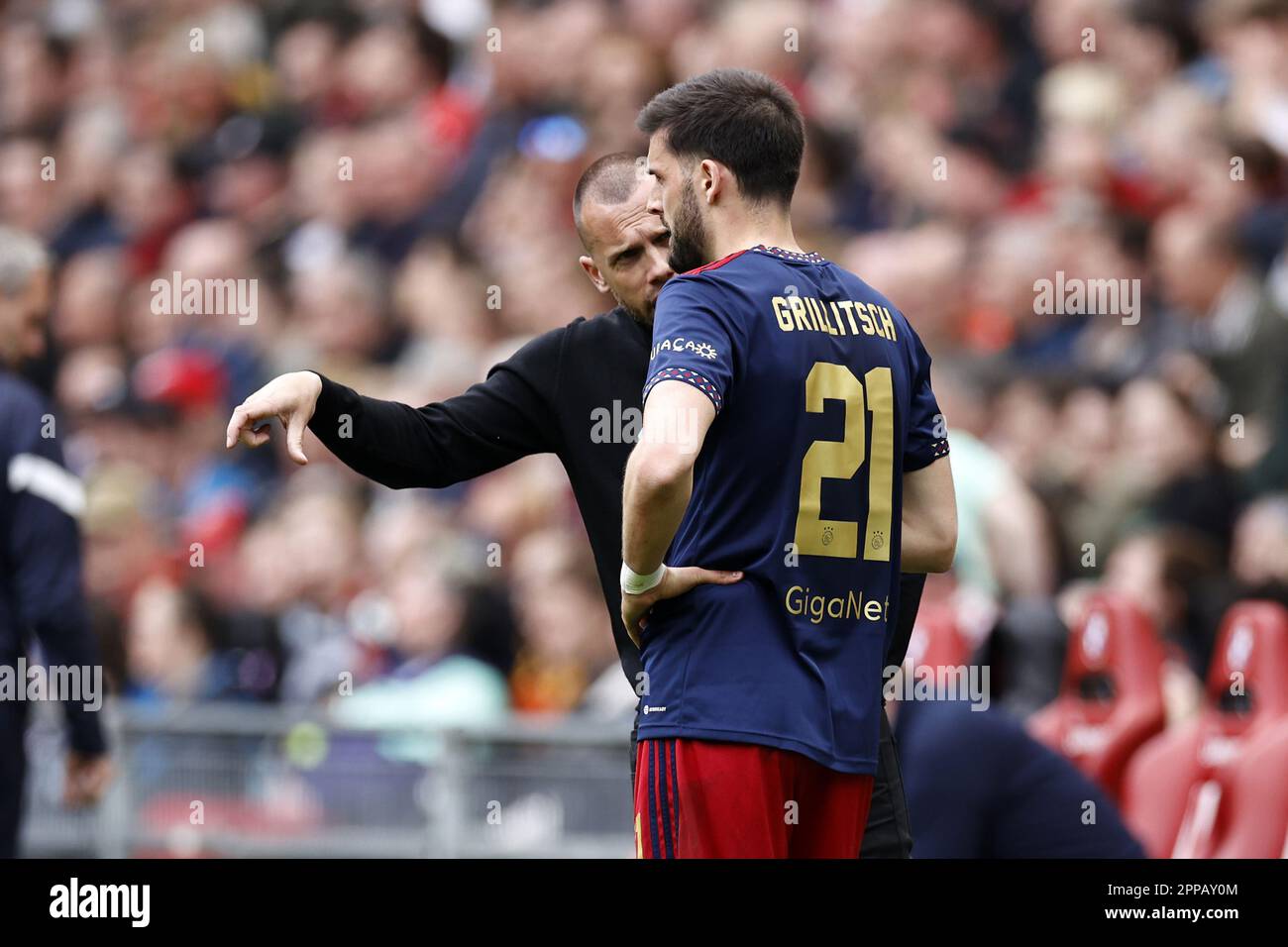 EINDHOVEN - (lr) Ajax coach John Heitinga, Florian Grillitsch of Ajax ...