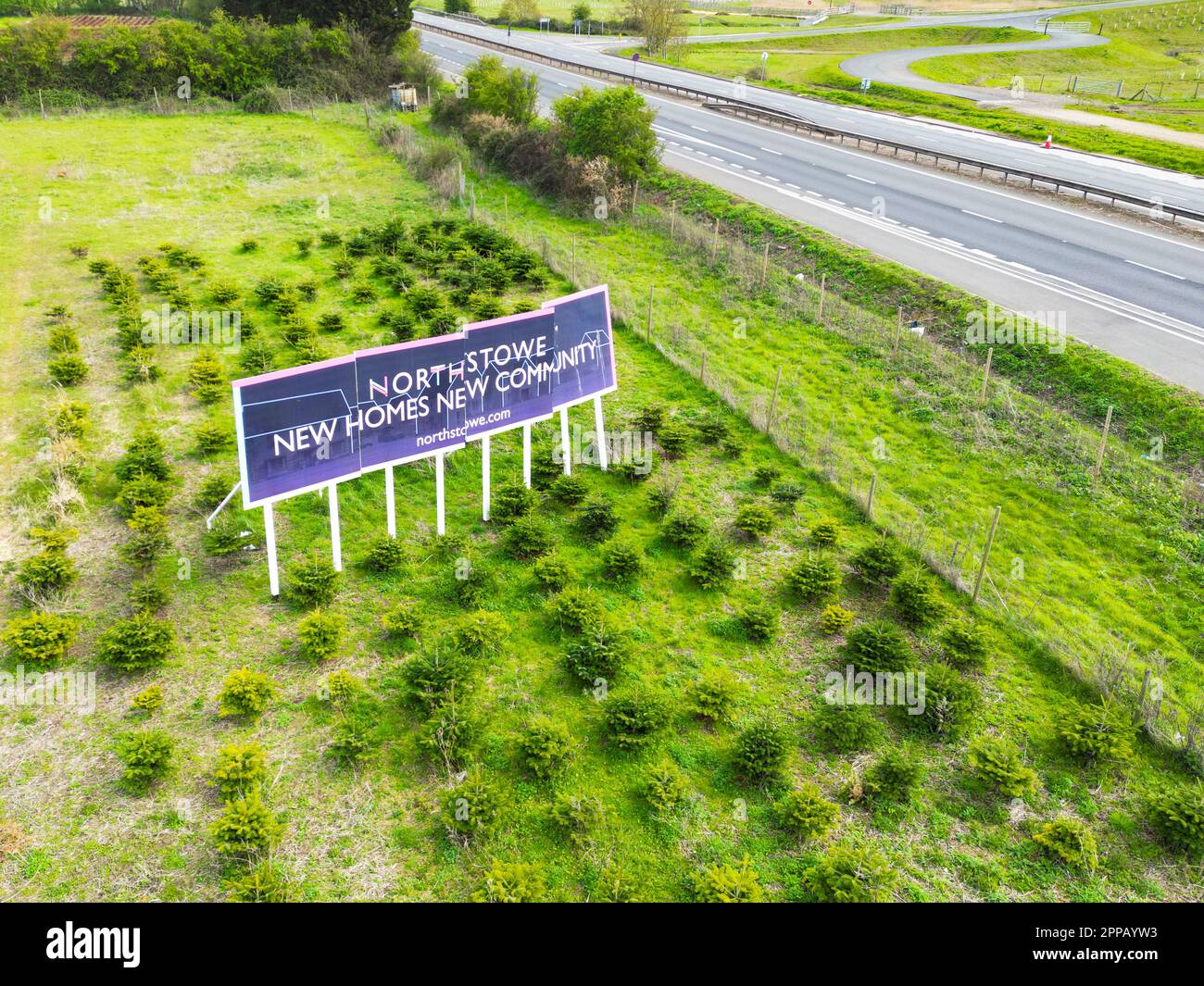 Large new home development sign seen in a field adjacent to a ...