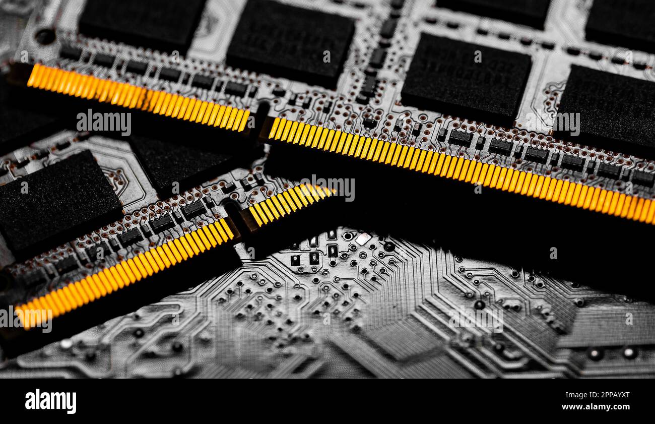 Macro Close up of computer RAM chip and motherboard on dark background ...