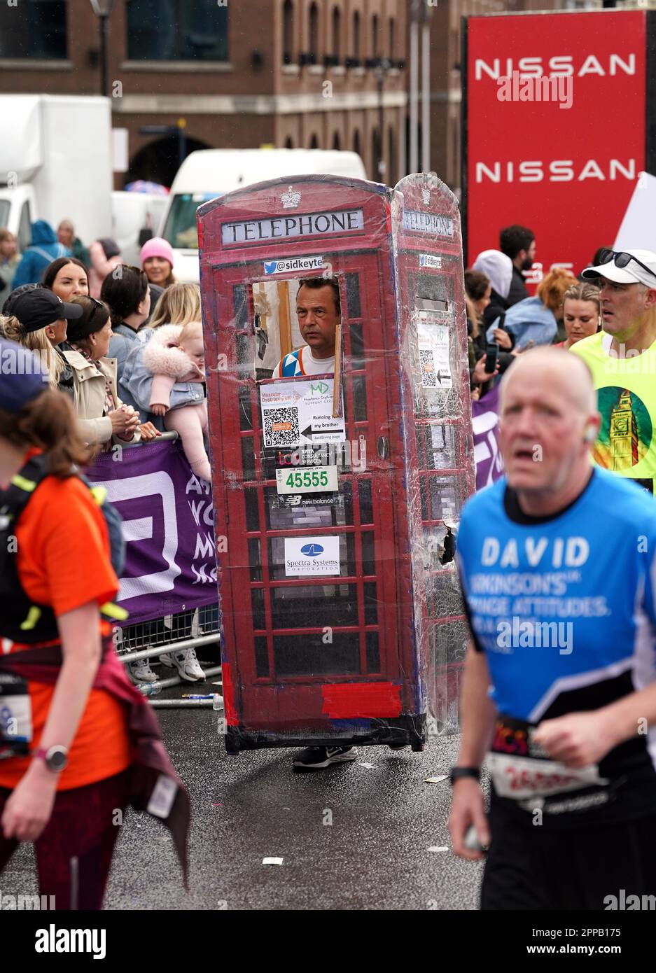 A competitor in a telephone box fancy dress during the TCS London ...