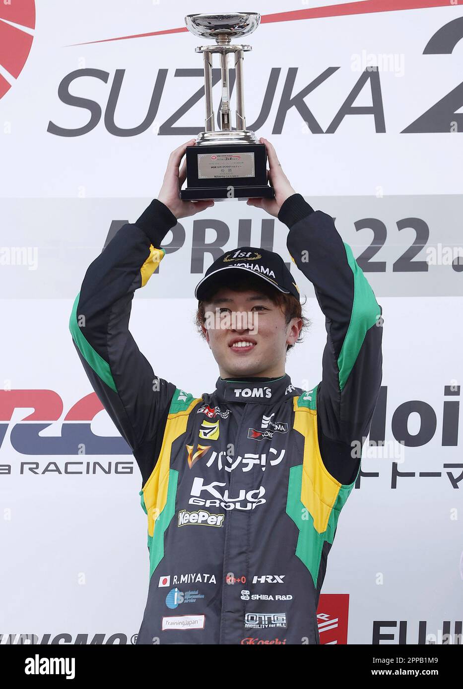 Tom's driver Ritomo Miyata raises the winning trophy after earning his first title of the Super ...