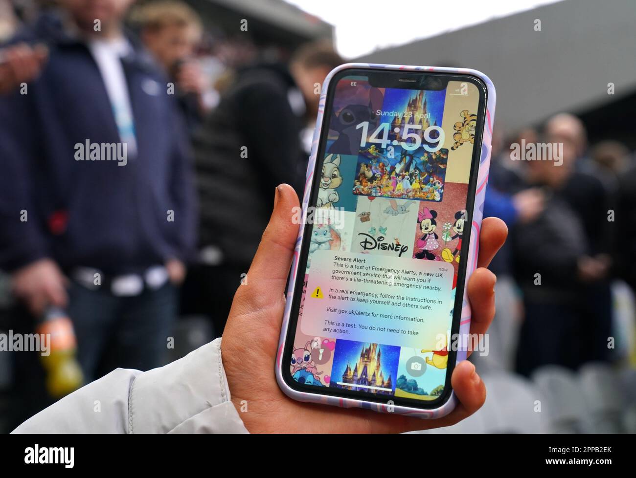 An emergency text alert test on the phone of a fan during the Premier ...