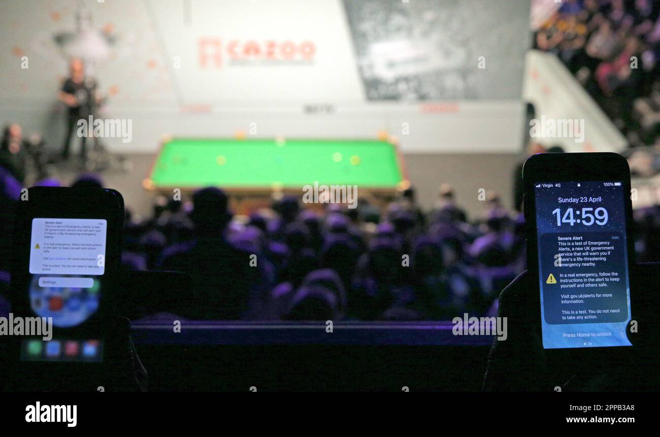Spectators phones show the 3pm National Alert Test during the match ...