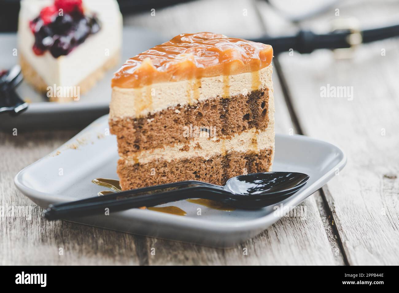 Mocha Caramel Cake in a plate on the table Stock Photo - Alamy