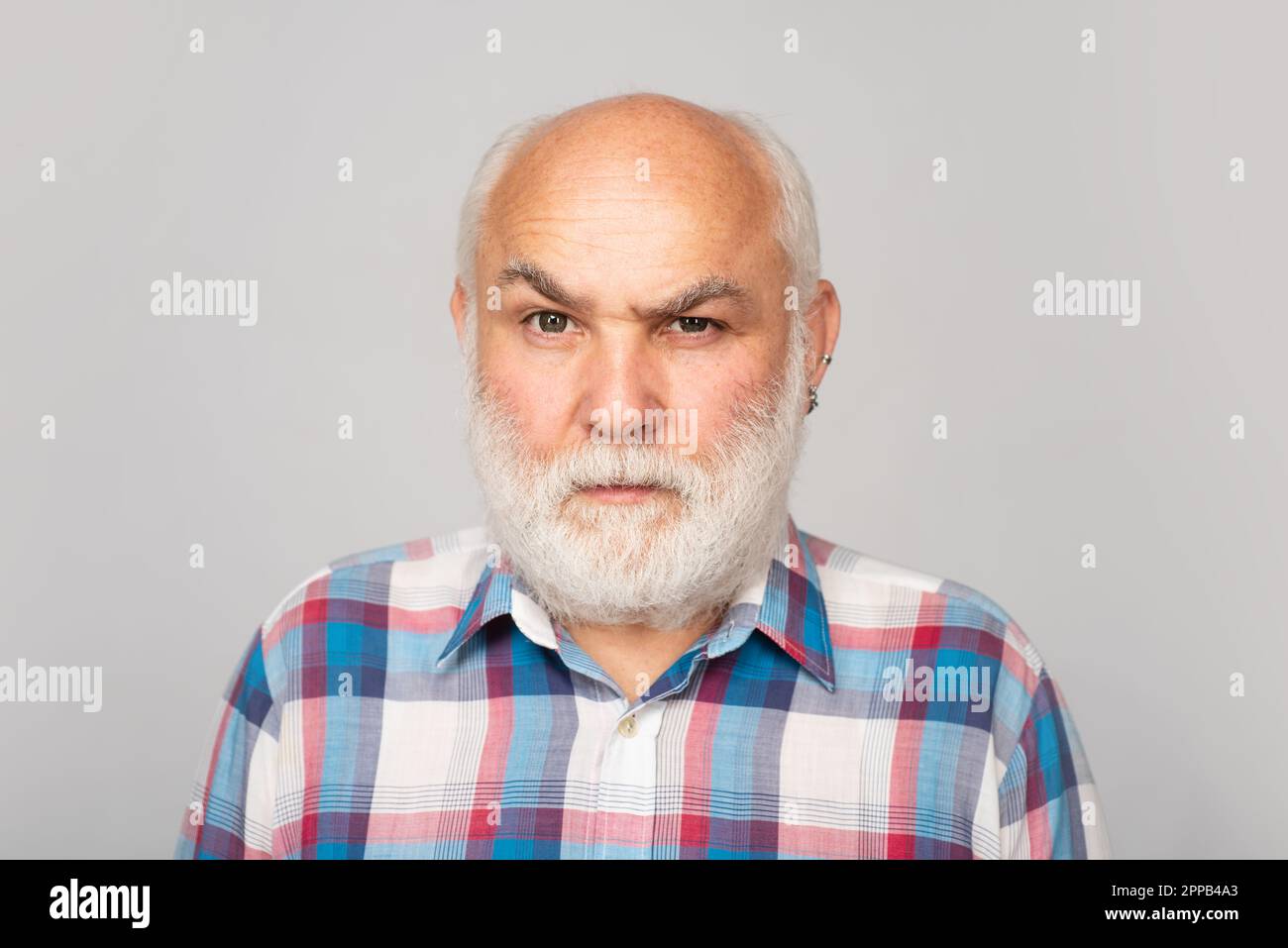 Mature man. Close up face of handsome serious elder senior in studio. Older grandfather, grandpa ...