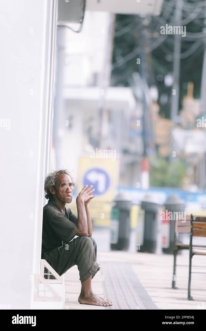 Homeless person begging on the street hi-res stock photography and ...