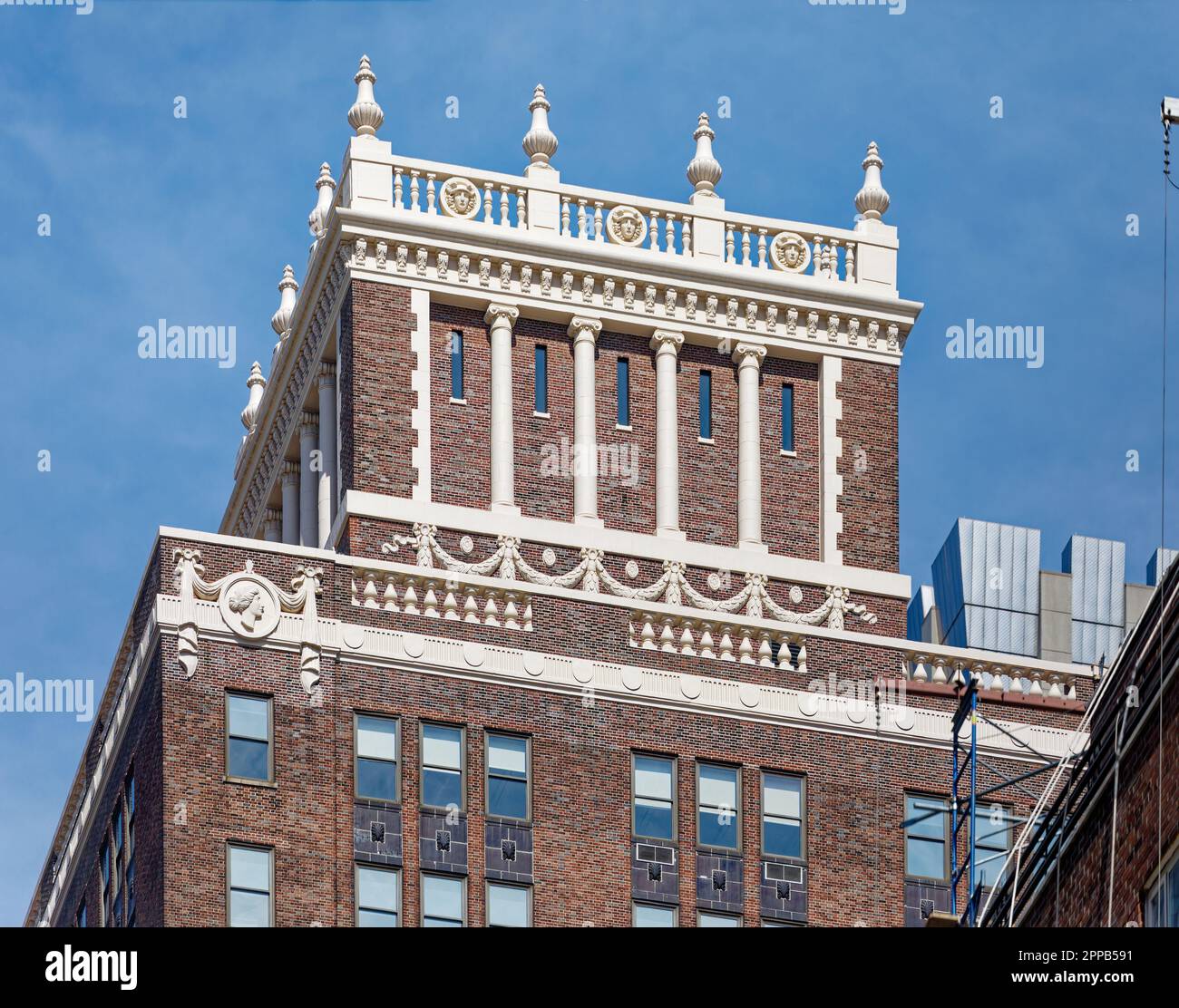 Bright white stone and terra cotta enliven the brick façade of 200 ...
