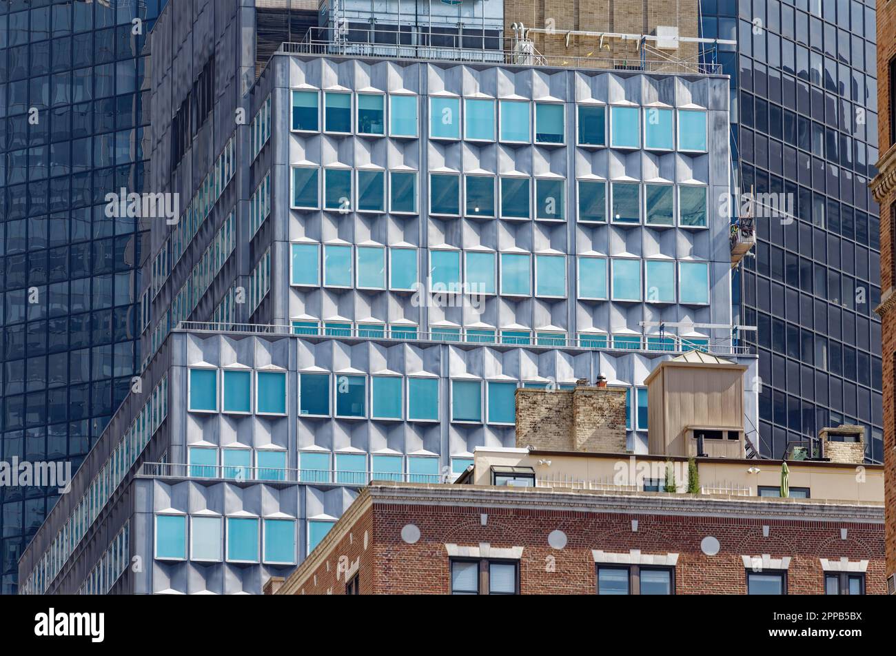 Light blue glass and gray aluminum panels make the Art Deco façade of ...